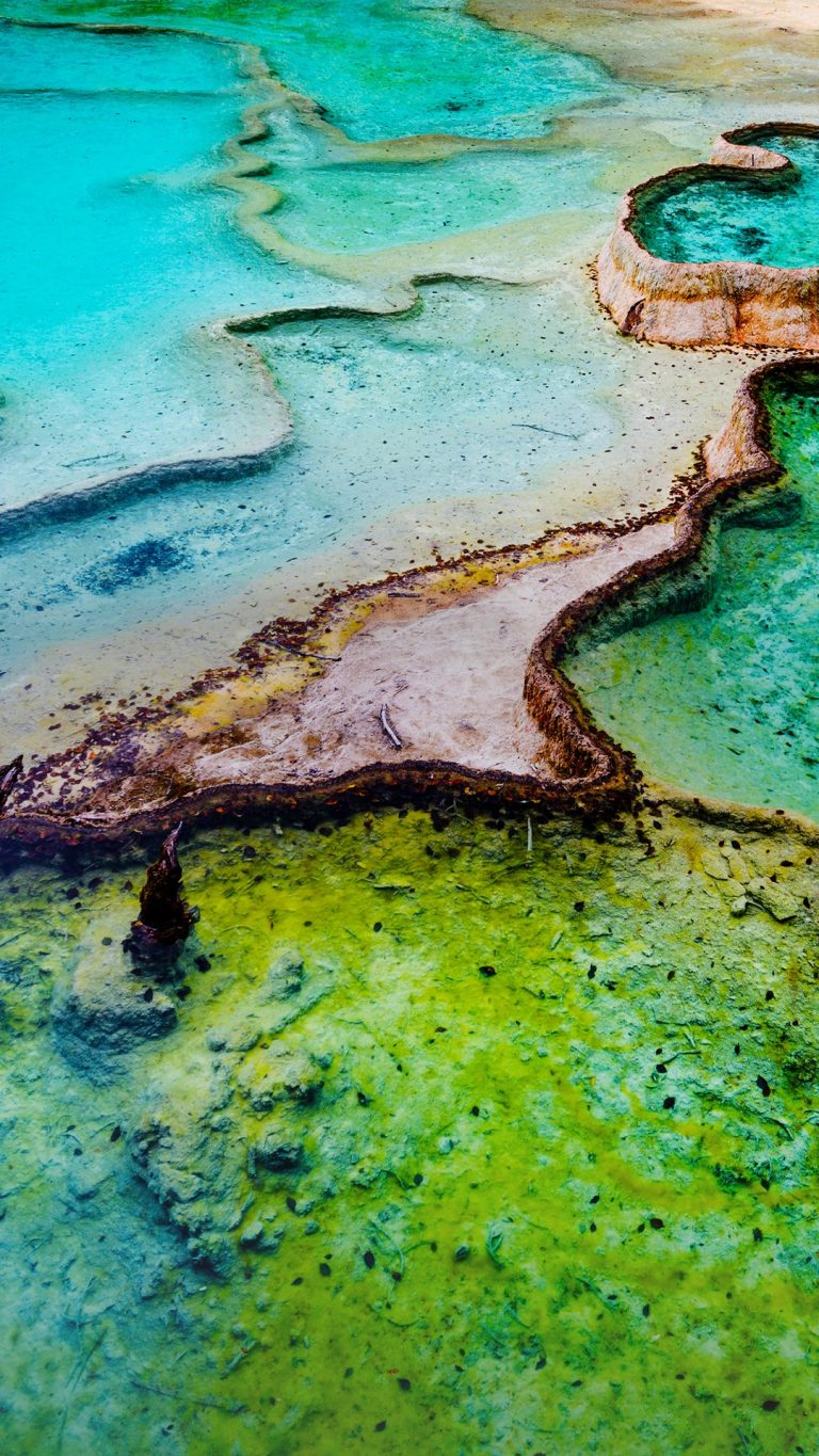 Colourful pools formed by calcite deposits, Huanglong, Sichuan province ...