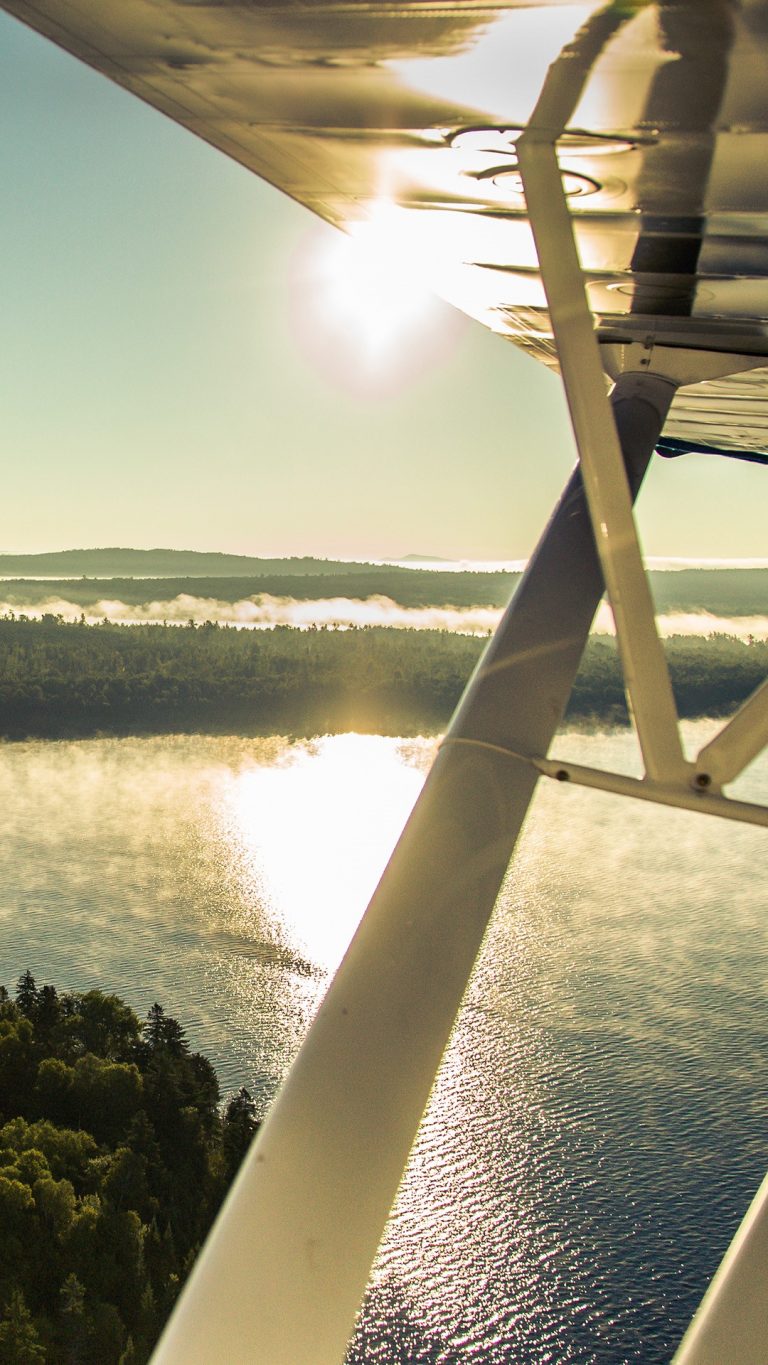 Detail of a flying biplane with beautiful view | Windows Spotlight Images