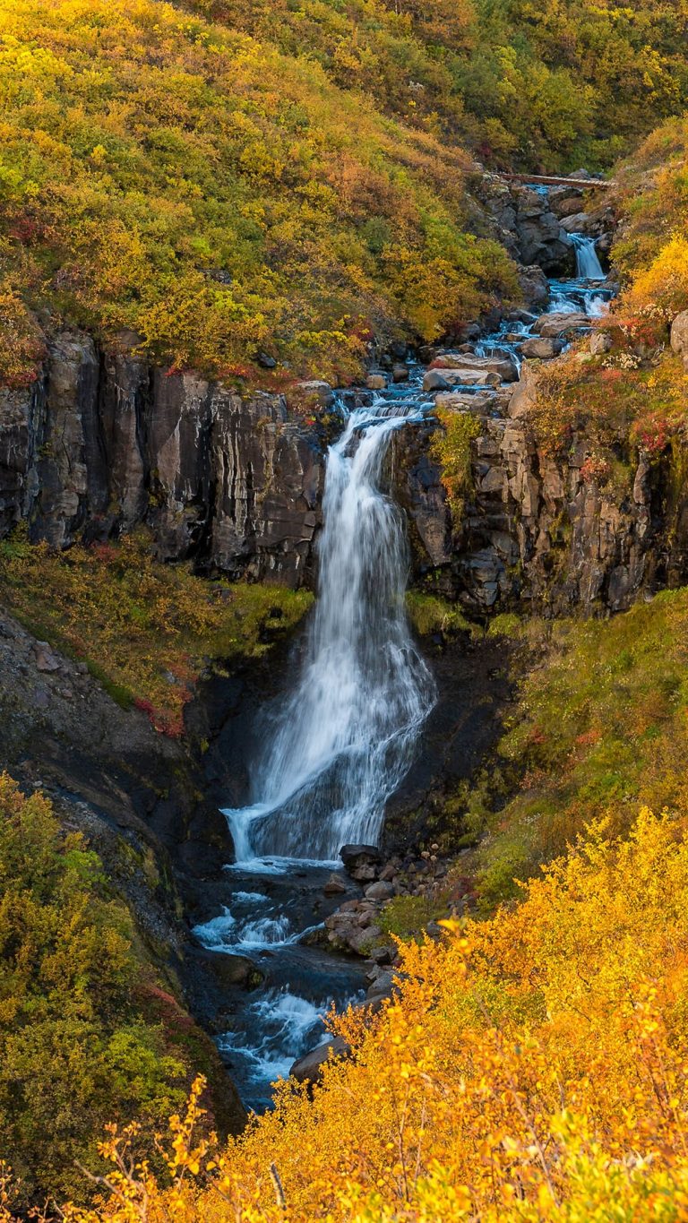 Waterfall in Skaftafell national park surrounded by heart-shaped space ...