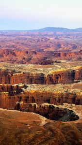 Canyon terrain at Grand View Point at sunset, Canyonlands National Park ...