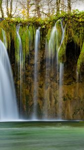 Waterfalls in sunny autumn morning light with fog, Plitvice Lakes ...