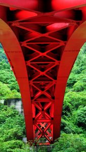 Looking at the red arch bridge across the forest, Taroko Gorge in ...
