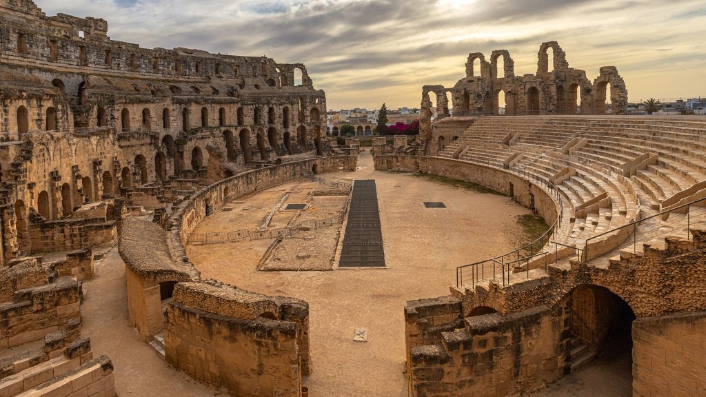 Entrance to ancient african Roman Colosseum amphitheatre at sunset, El ...